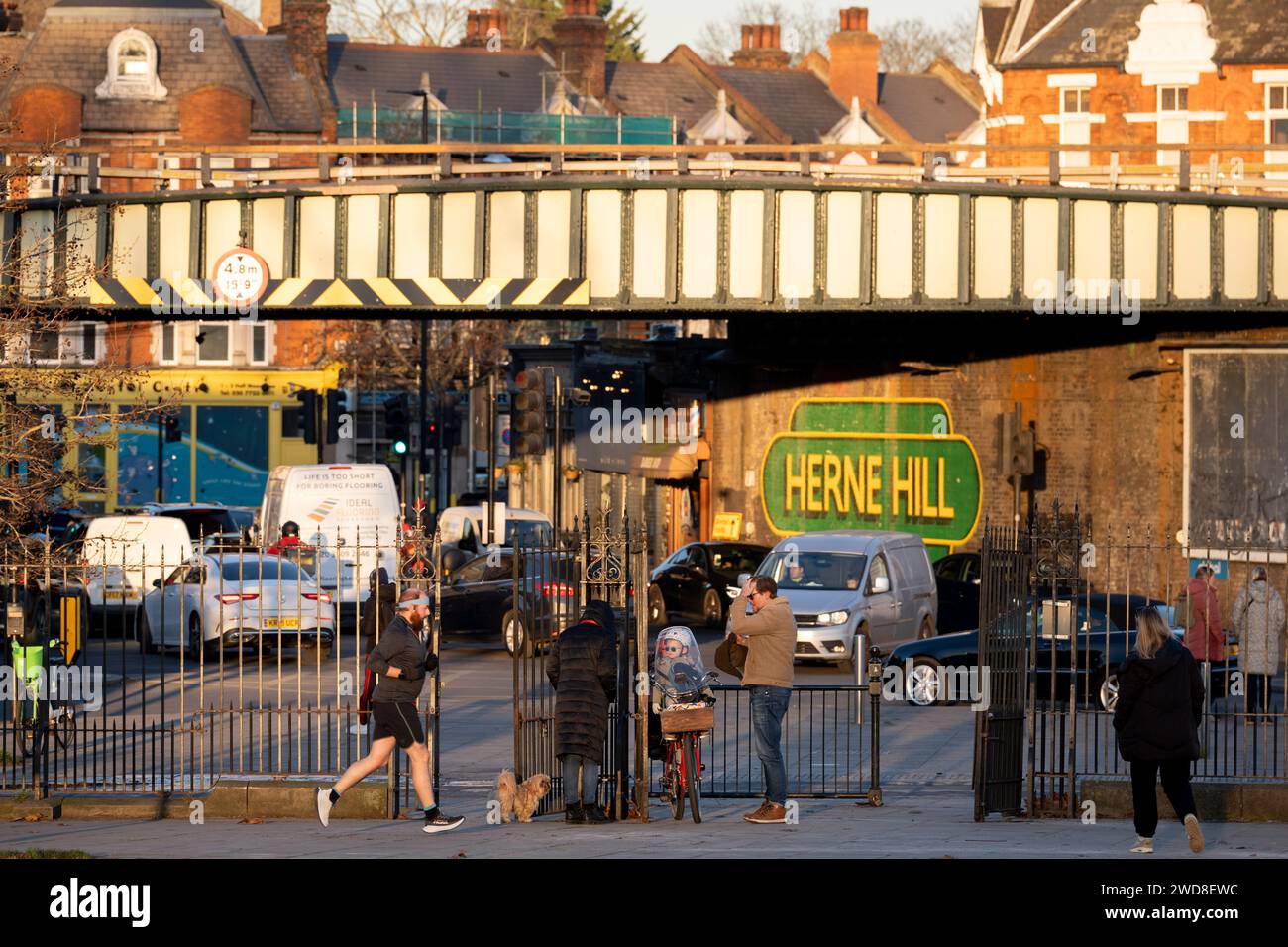 Local Londoners at the gates of Brockwell Park and the signage beneath ...