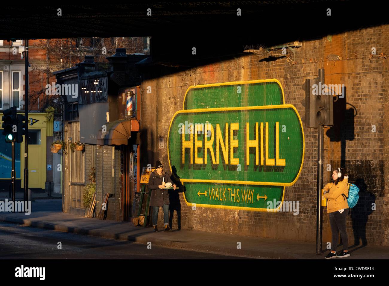 Local Londoners and the signage beneath the railway bridge in Herne ...