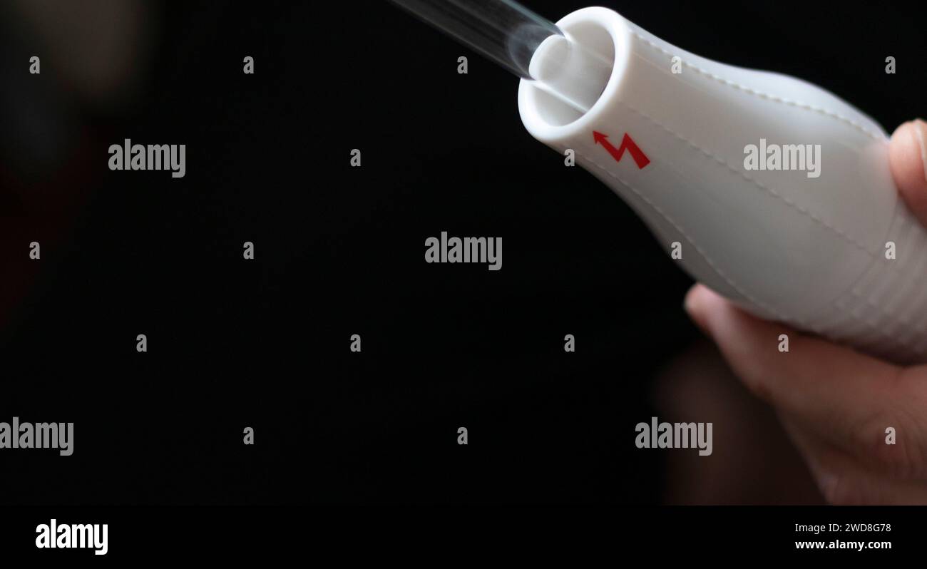 Close up shot of the high frequency comb tool for hair and scalp ...