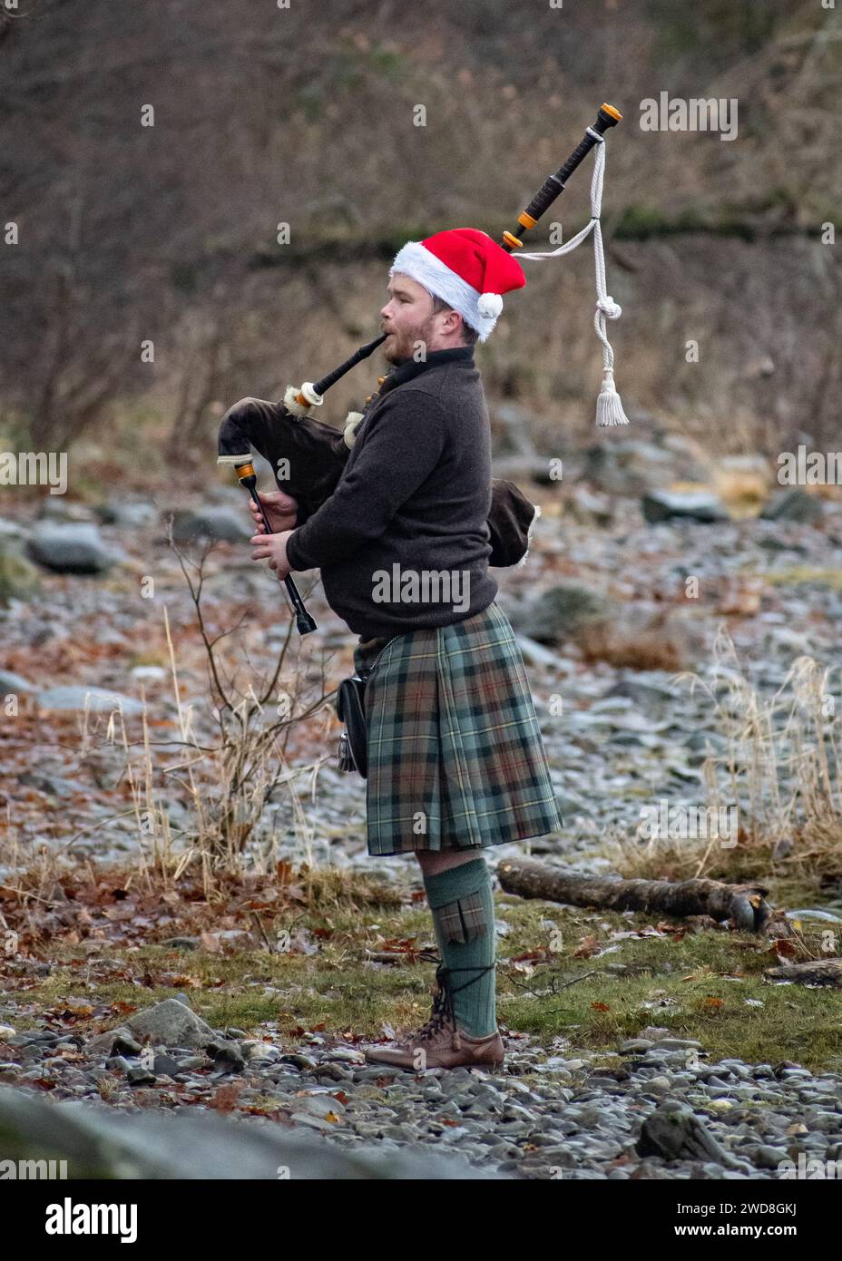 Scottish Bagpiper on the banks of a loch in Scotland Stock Photo - Alamy