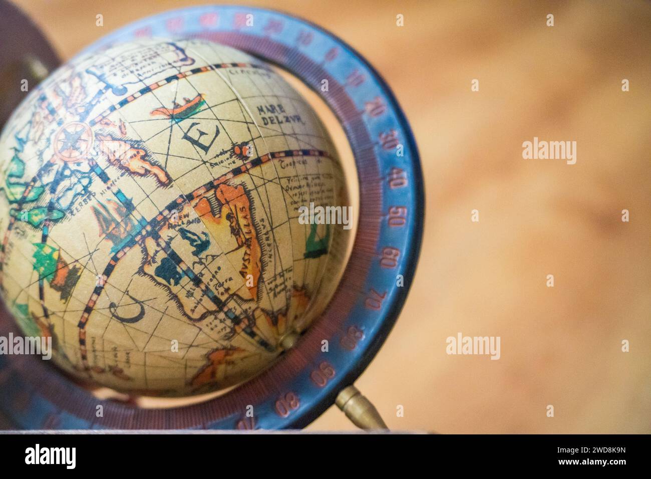 Earth Day concept. Australia Day, small globe with printed shapes of ...