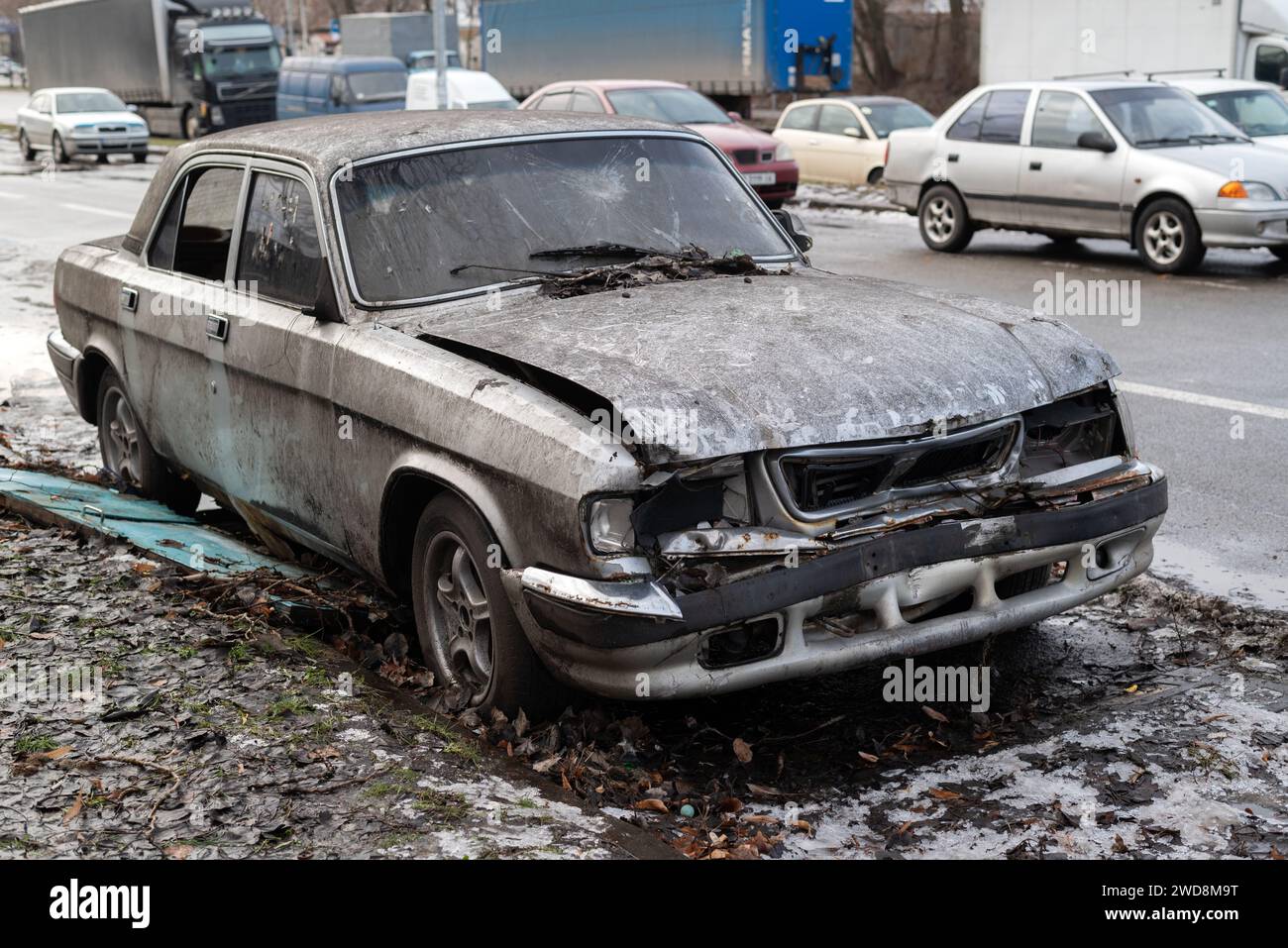 abandoned car broken by marauders on a city street in Ukraine Stock ...