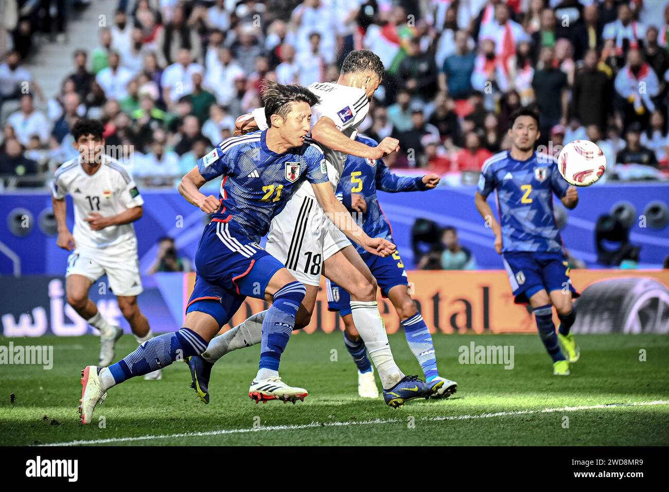 Doha, Qatar. 19th Jan, 2024. Iraq's Aymen Hussein (C) shoots and scores ...