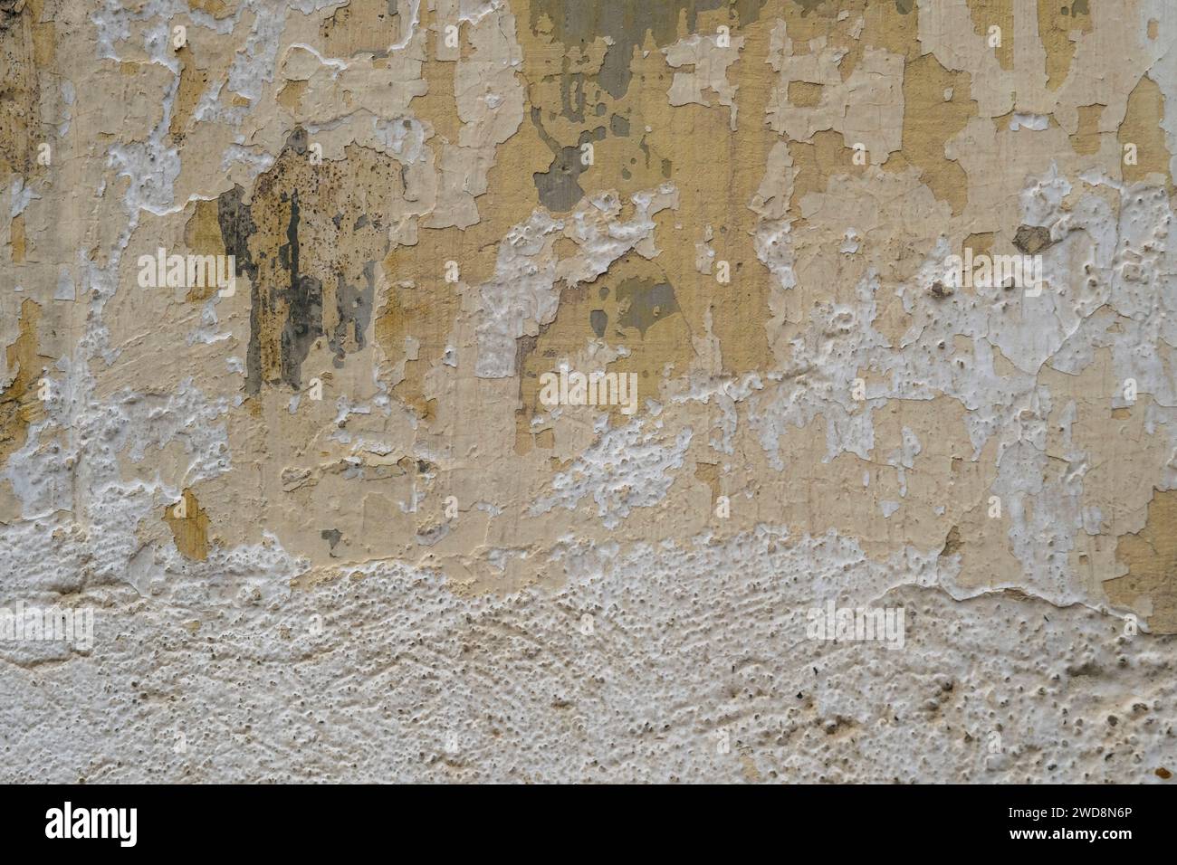 Detail of old painted wall with scraps of flaking paint layers, grunge ...