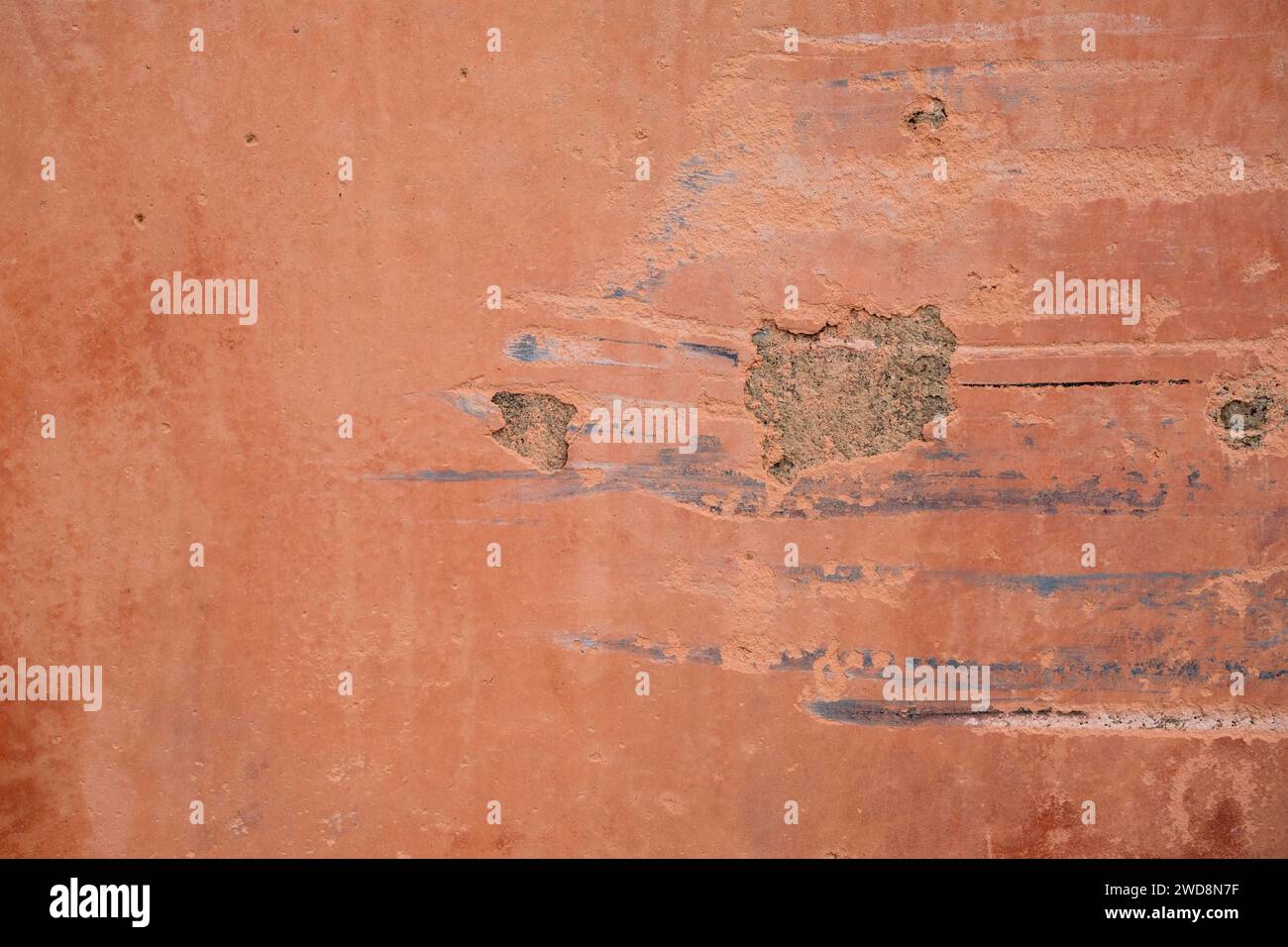 Old coral pink colored wall with crack, grunge background Stock Photo ...