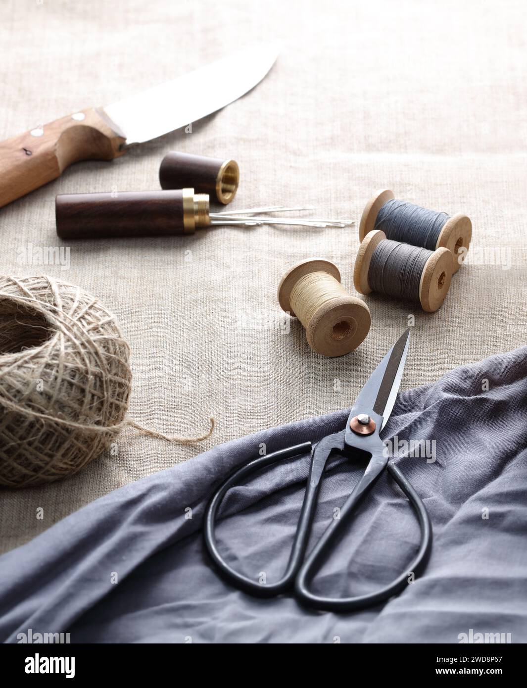 sewing threads with needles and scissors on a canvas.jpg Stock Photo ...