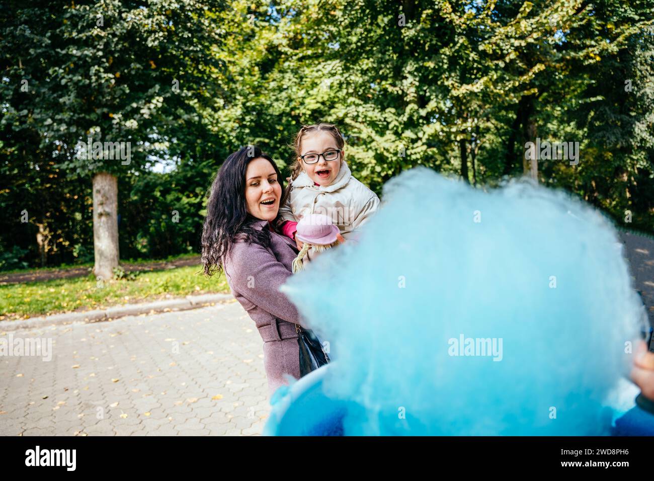 Girl child waiting cotton candy hi-res stock photography and images - Alamy