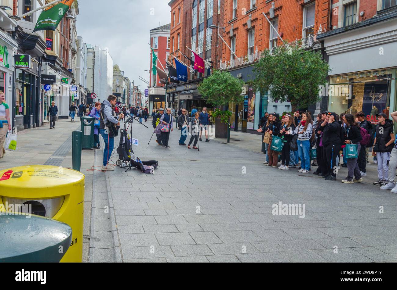 Dublin, Leinster, Ireland September 26 2023 - Busker entertaining ...