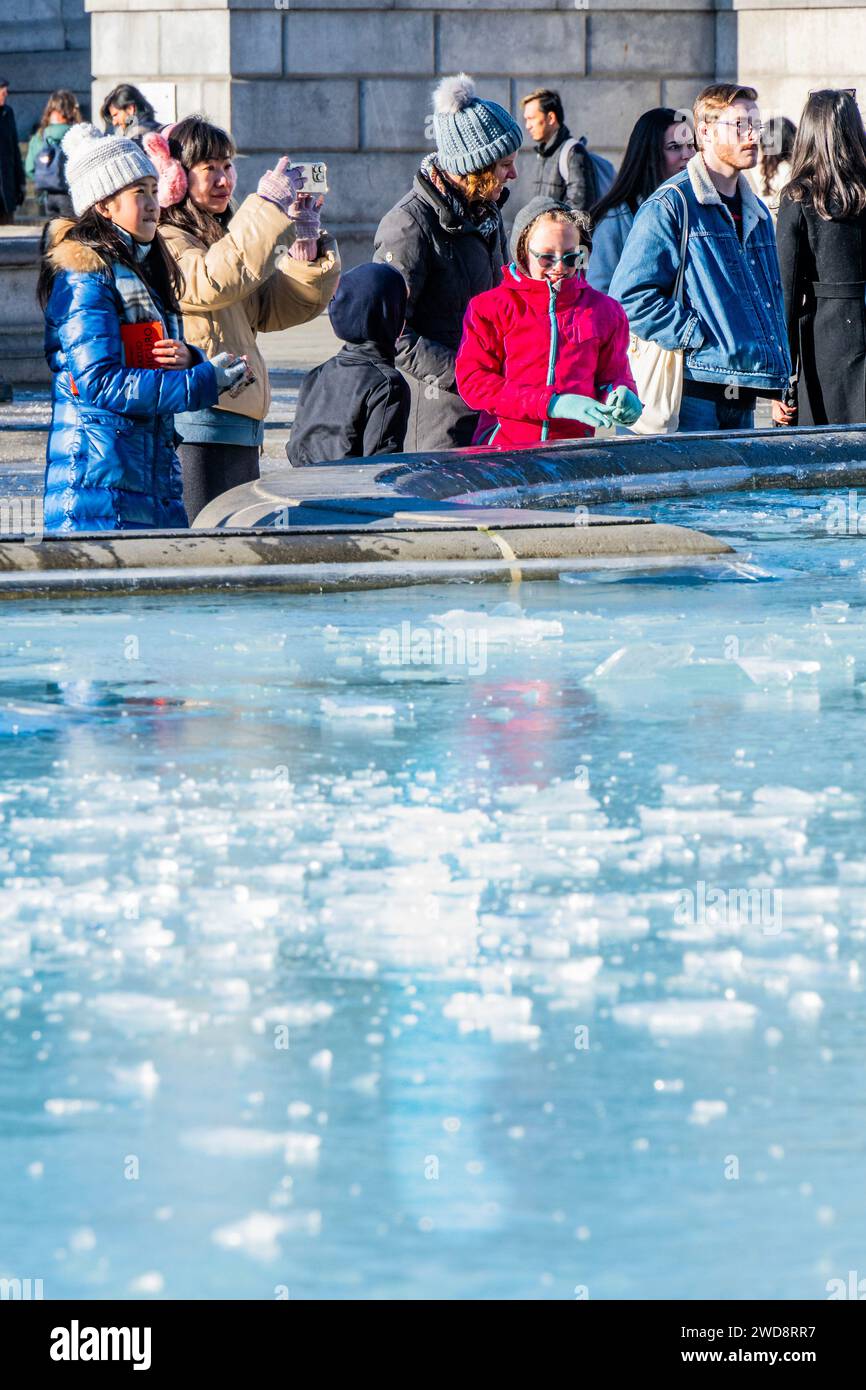 London, UK. 19th Jan, 2024. Tourists enjoy the frozen fountains as ...