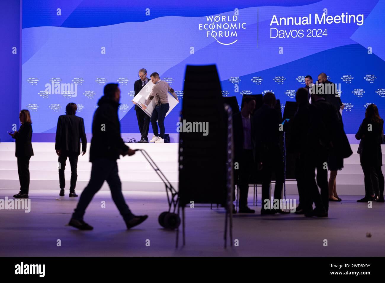 Davos, Switzerland. 19th Jan, 2024. Employees clear a conference hall ...