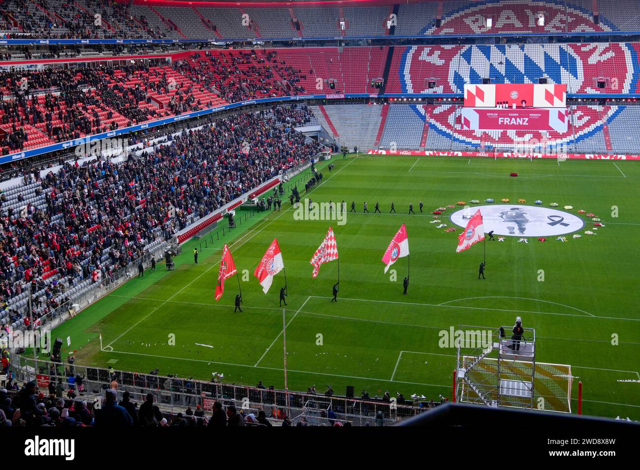 Flower wreaths surround a photograph of Bayern and Germany legend Franz ...
