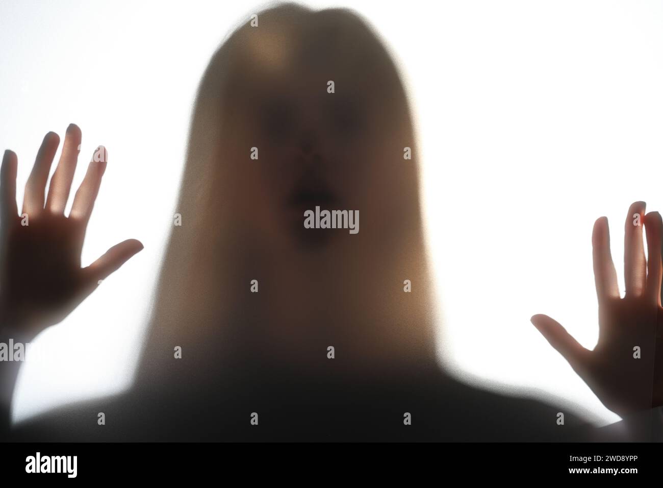 Silhouette of creepy ghost behind glass against white background Stock ...