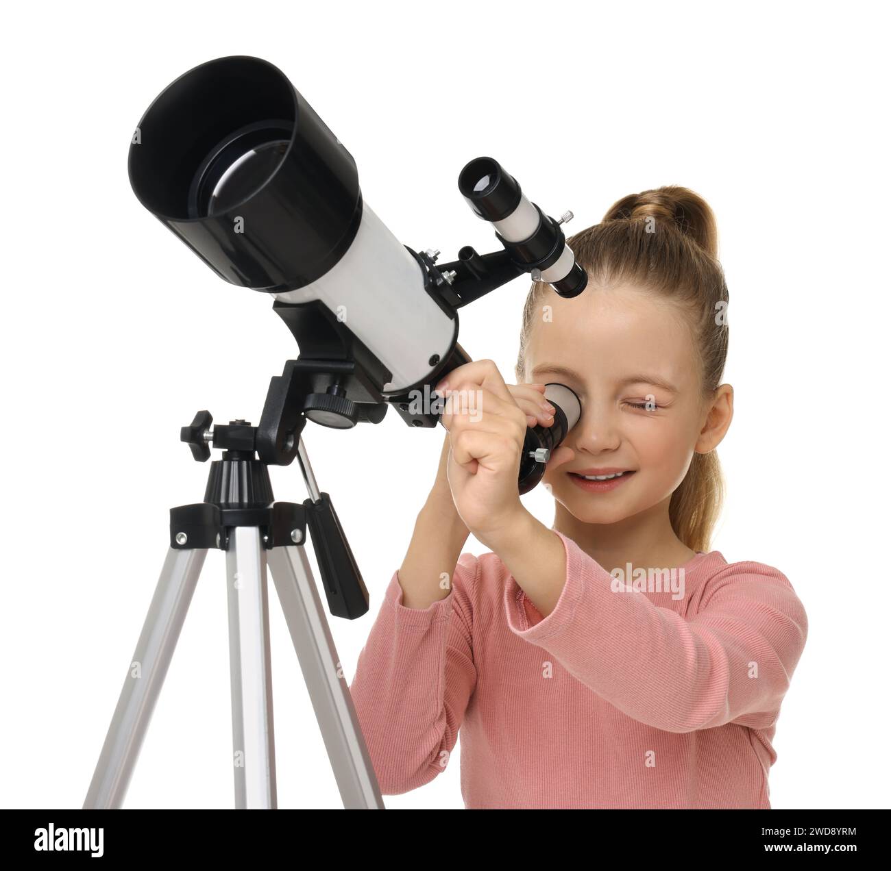 Cute little girl looking at stars through telescope on white background ...