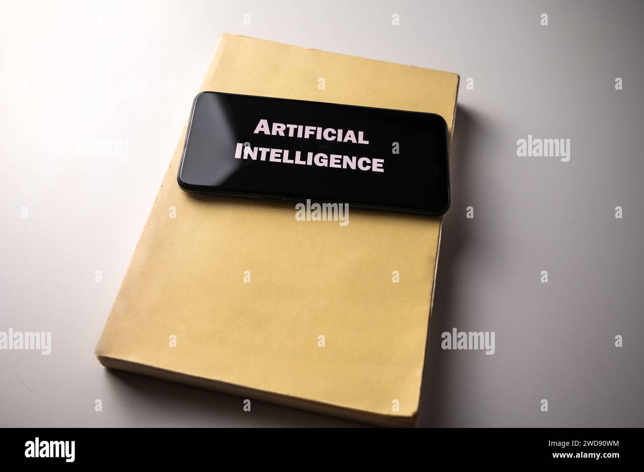 Book and device with text Artificial Intelligence. Learning, use, tools and data processing of ...