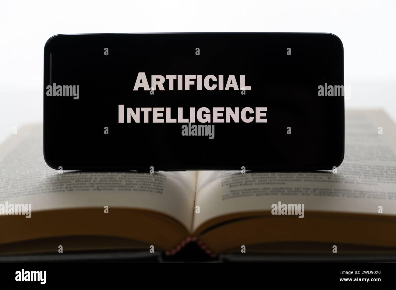 Book and device with text Artificial Intelligence. Learning, use, tools and data processing of ...