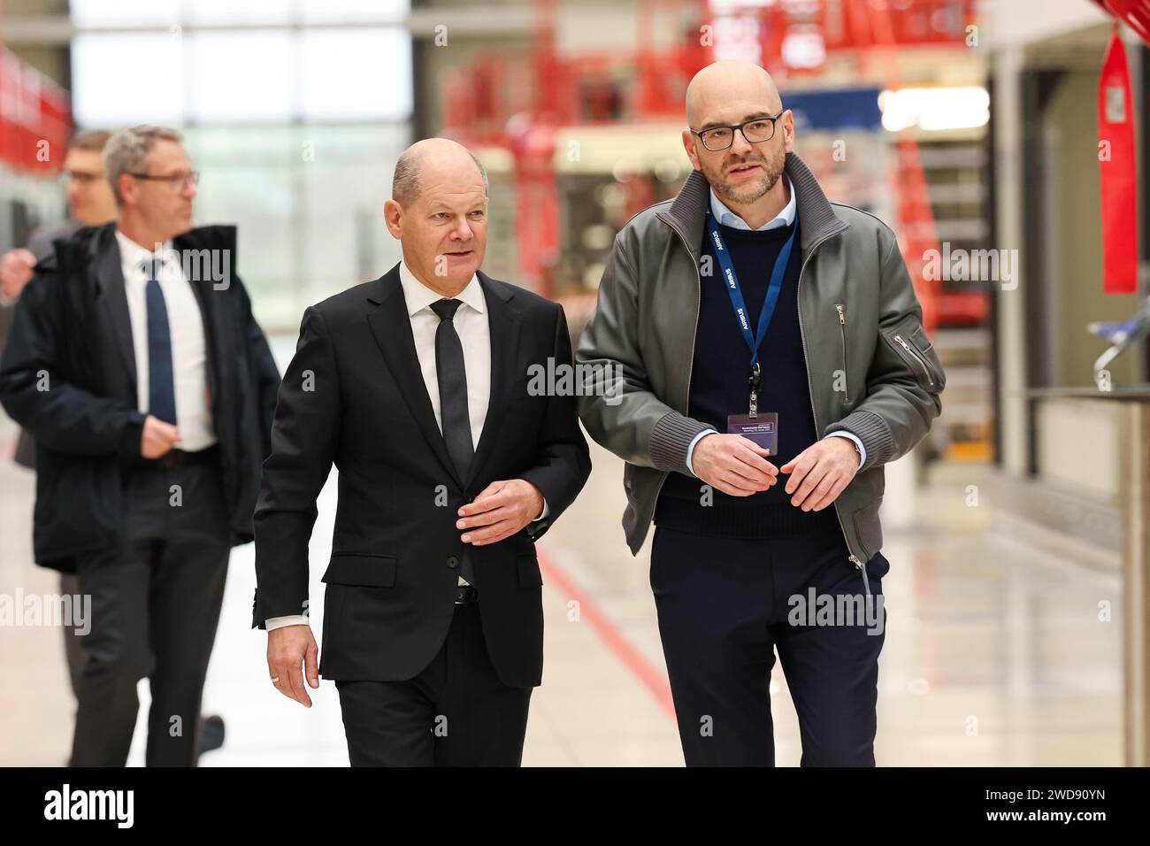 Manching, Germany. 19th Jan, 2024. Chancellor Olaf Scholz (SPD, center ...