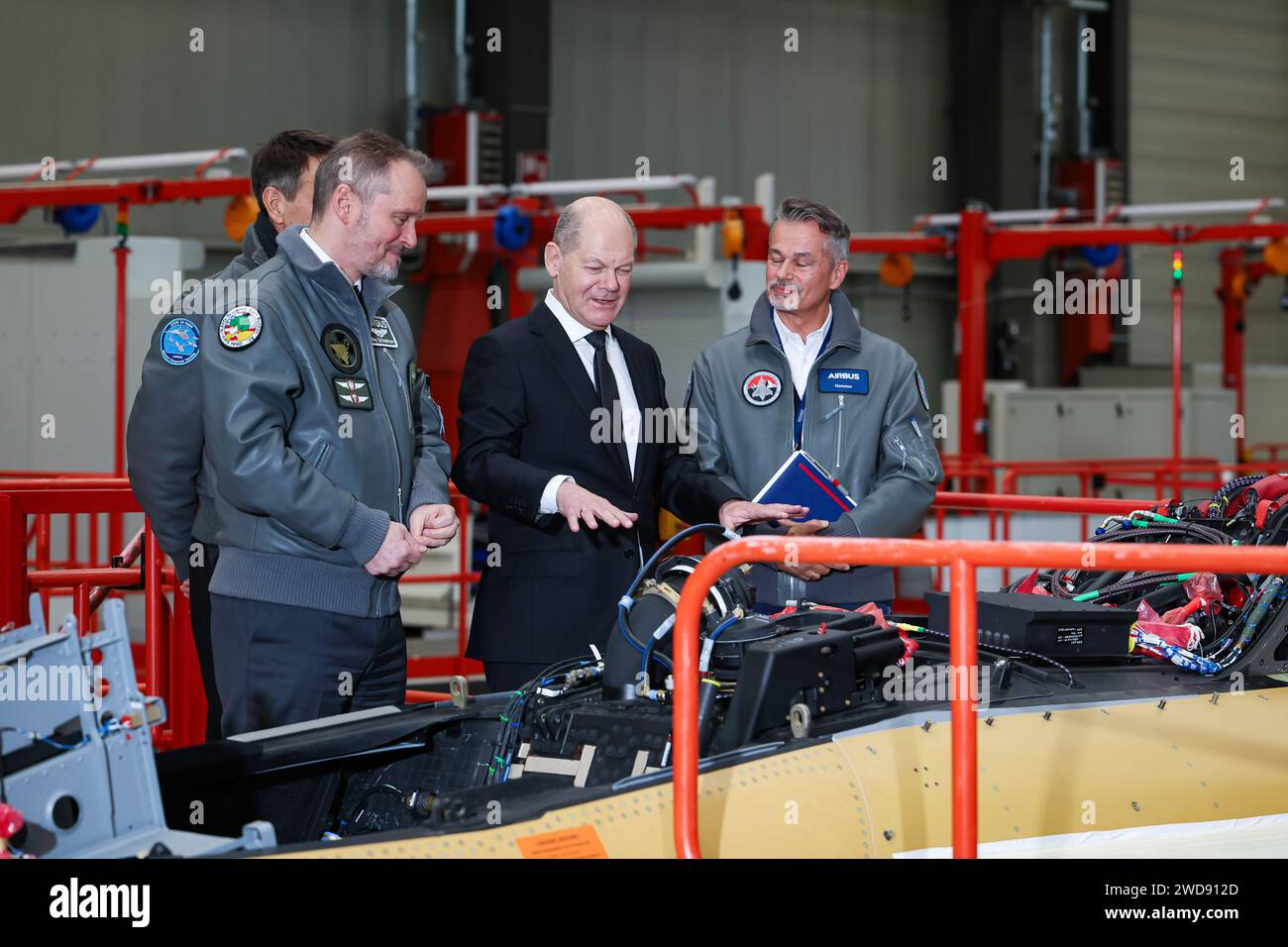Manching, Germany. 19th Jan, 2024. Chancellor Olaf Scholz (SPD, center ...
