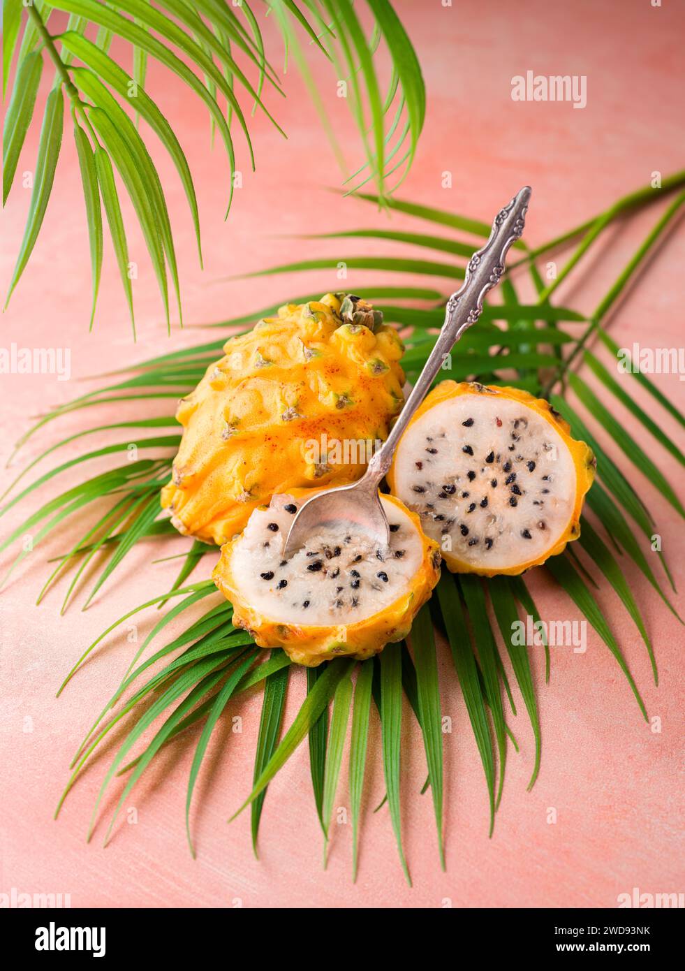 Yellow dragon fruit on palm leaves with copy space Stock Photo - Alamy