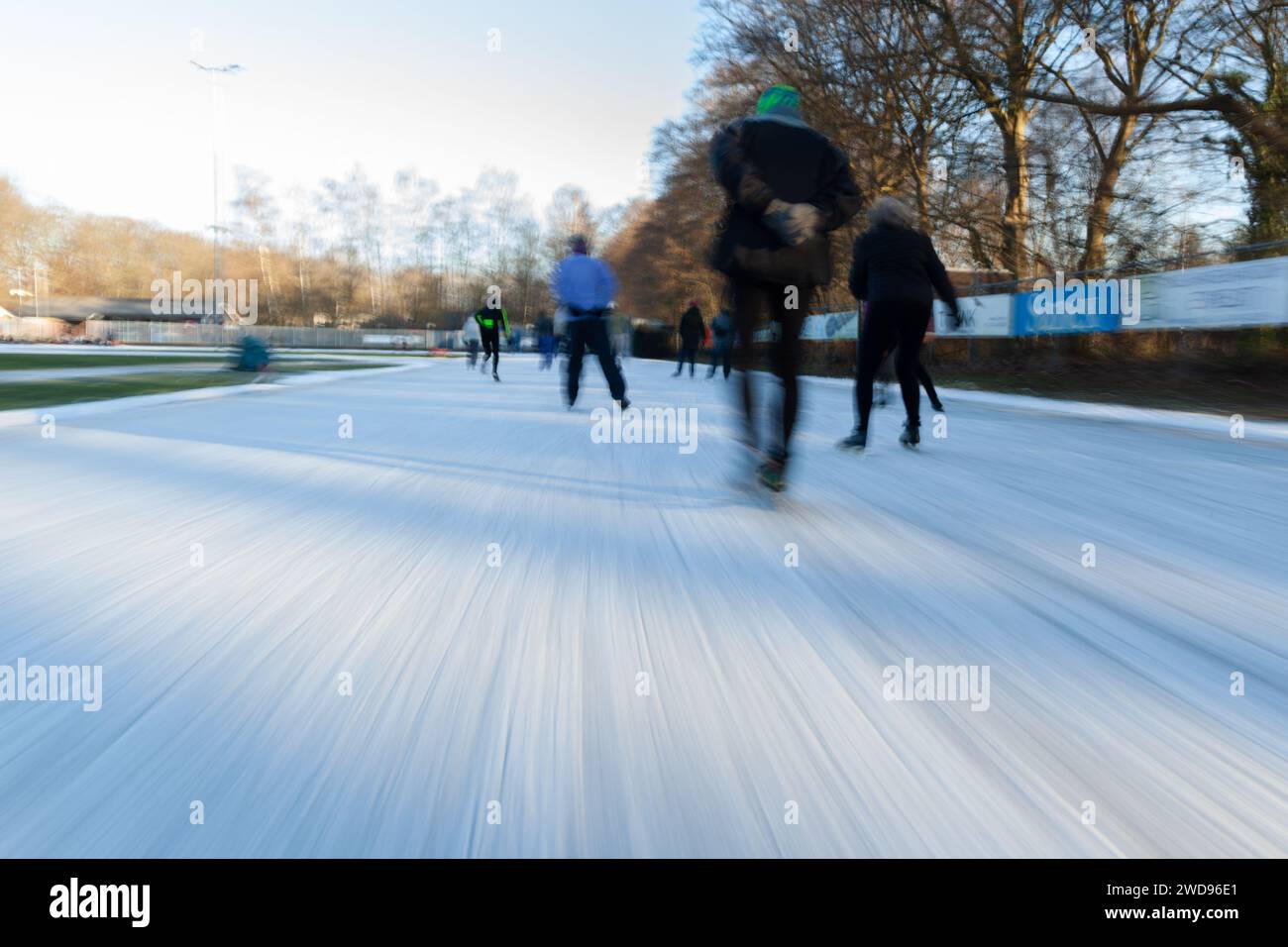 Ice-skating on a track in the woods on a cold sunny morning Stock Photo ...