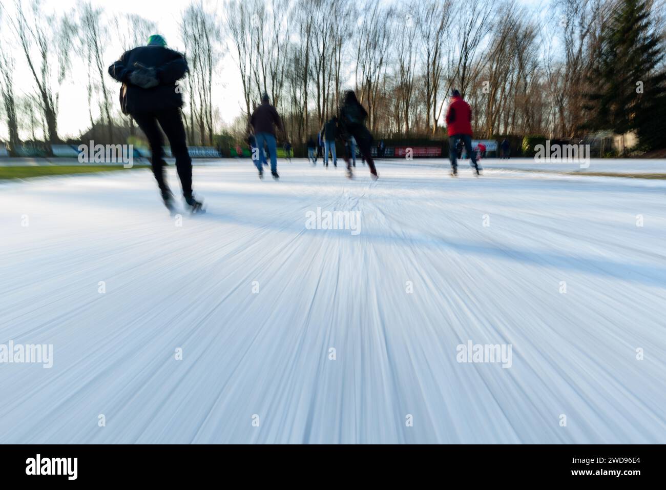Ice-skating on a track in the woods on a cold sunny morning Stock Photo ...