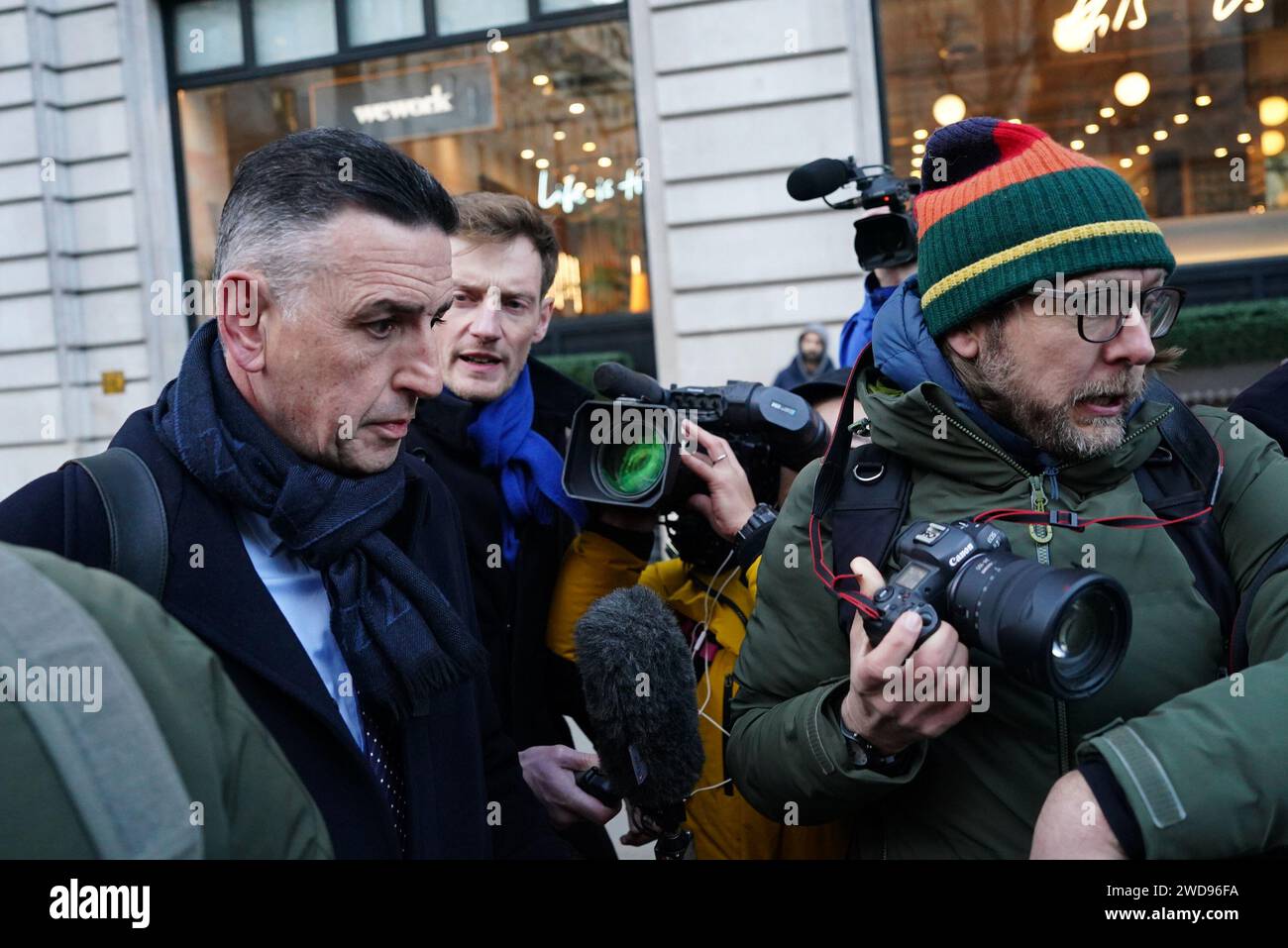 Fujitsu's European boss Paul Patterson (right) is surrounded by media ...