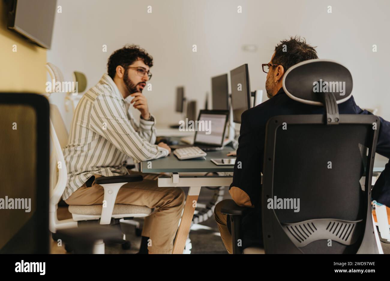 Business employees collaborating in a creative office for strategy and ...
