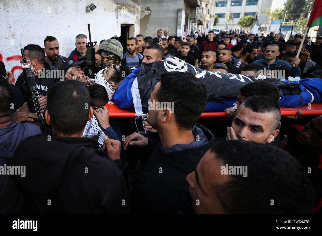 Tulkarm, Palestinian Territories. 19th Jan, 2024. Mourners carry the ...