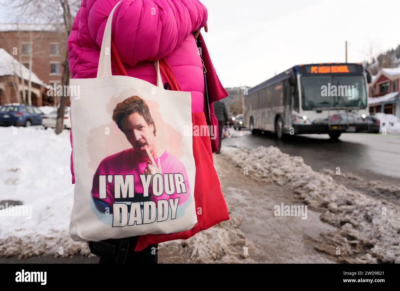 A Sundance volunteer holds a Pedro Pascal tote bag on the opening day ...