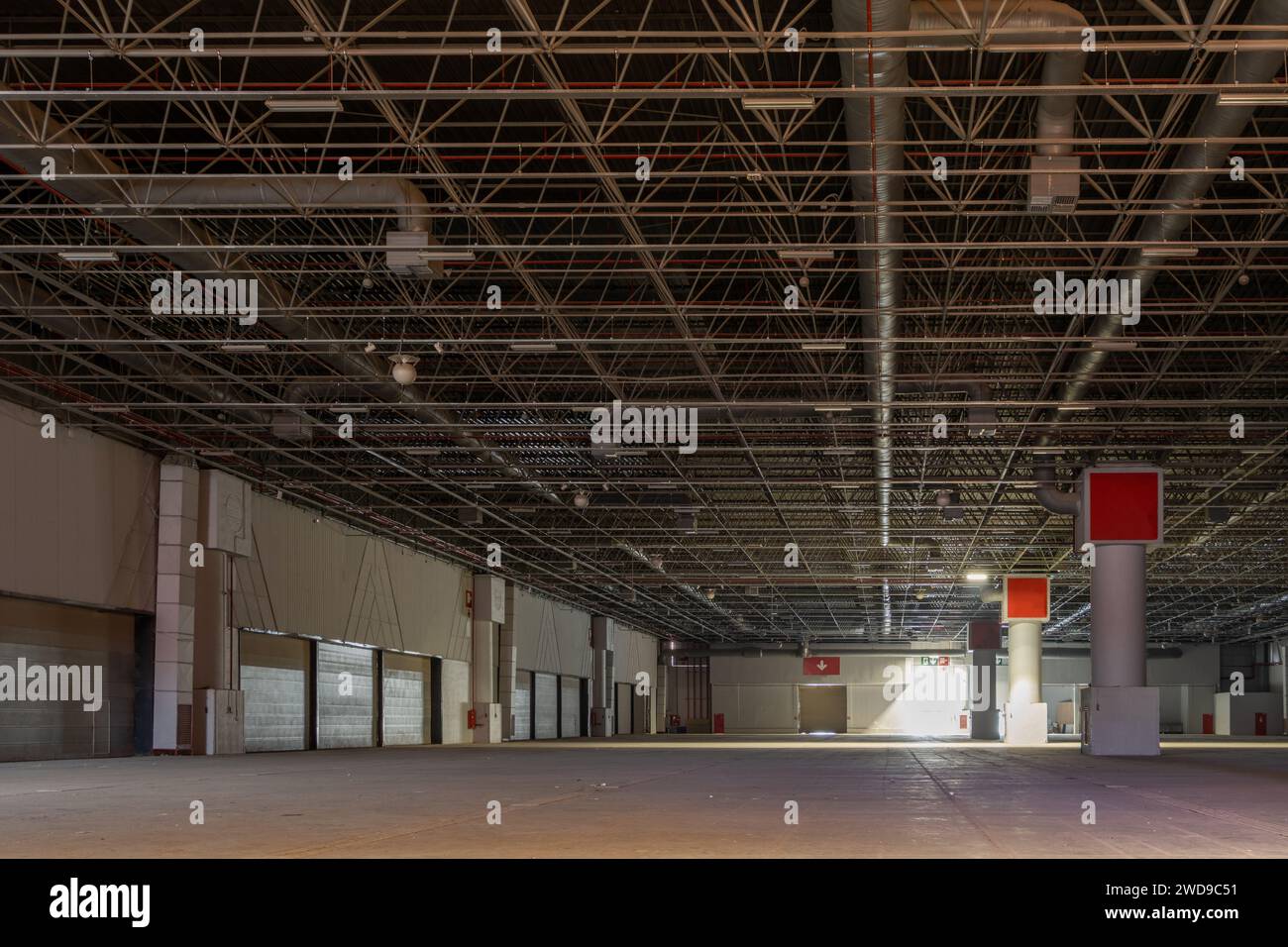 Empty and dark large warehouse. factory warehouse, interior view ...