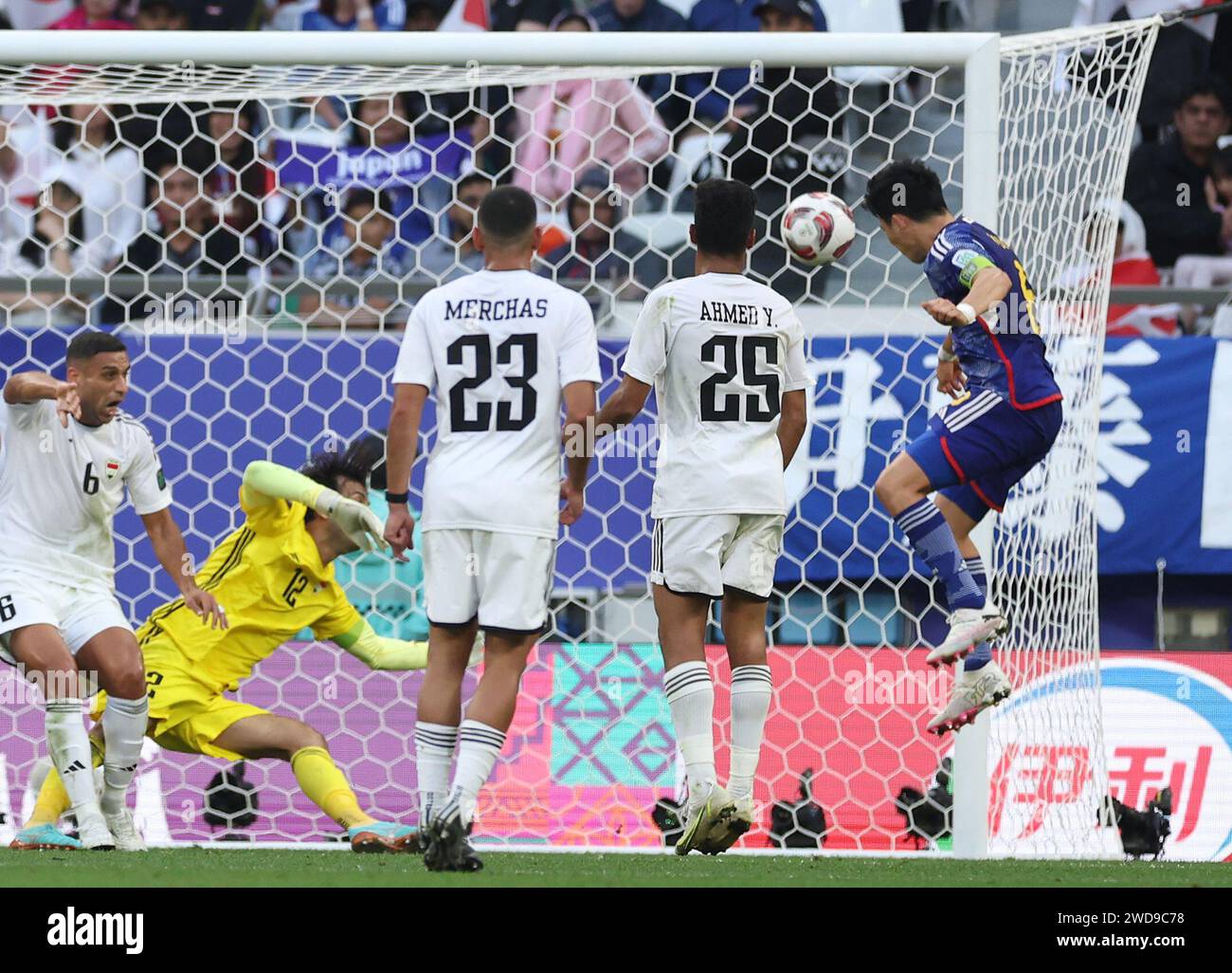 Doha, Qatar. 19th Jan, 2024. Japan's Endo Wataru (1st R) heads the ball ...