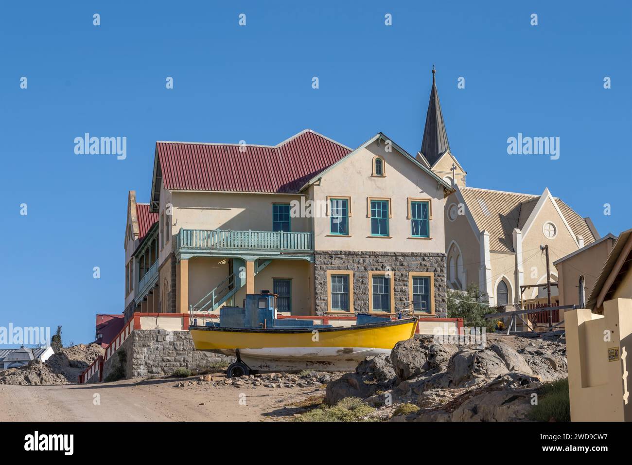 cityscape with old boat ashore and picturesque building at historical ...
