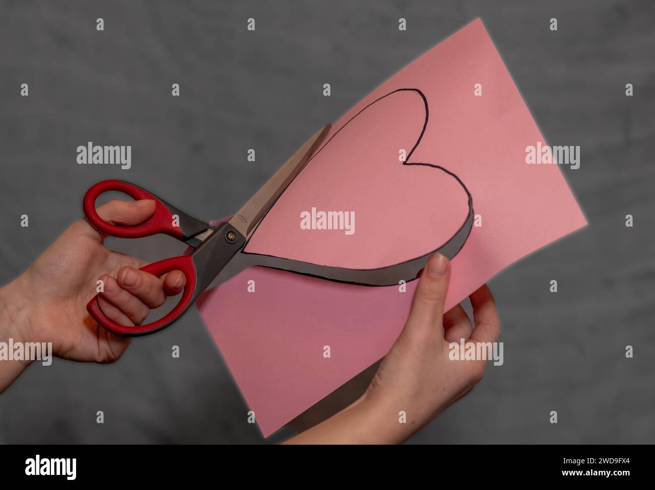 Cutting out heart for homemade Valentine Stock Photo - Alamy