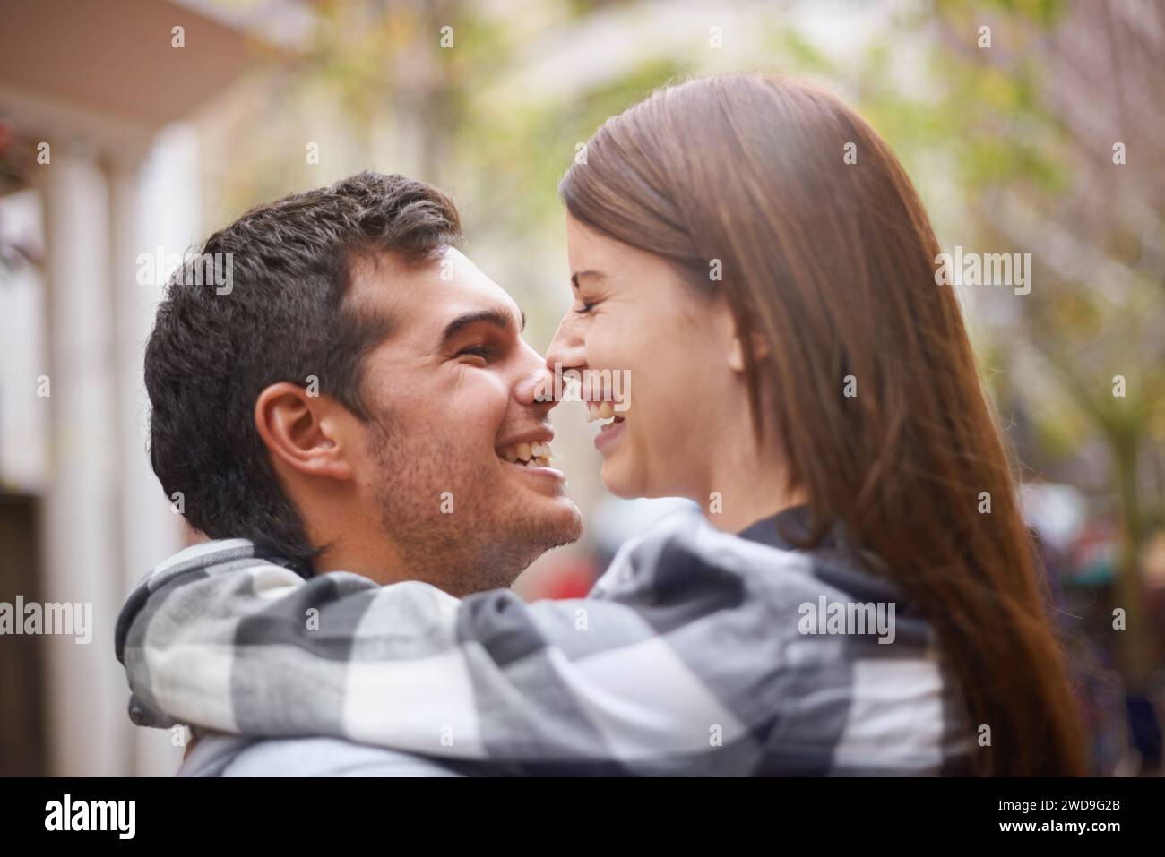 Love, hug and happy couple laughing together, having fun and enjoy ...