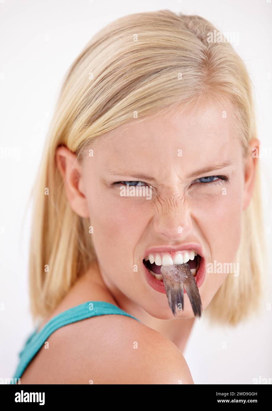 Woman, eating and portrait with fish, tail or dislike strange food in ...