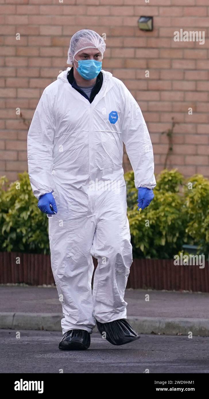 A forensic investigator outside a house in Costessey near Norwich after ...