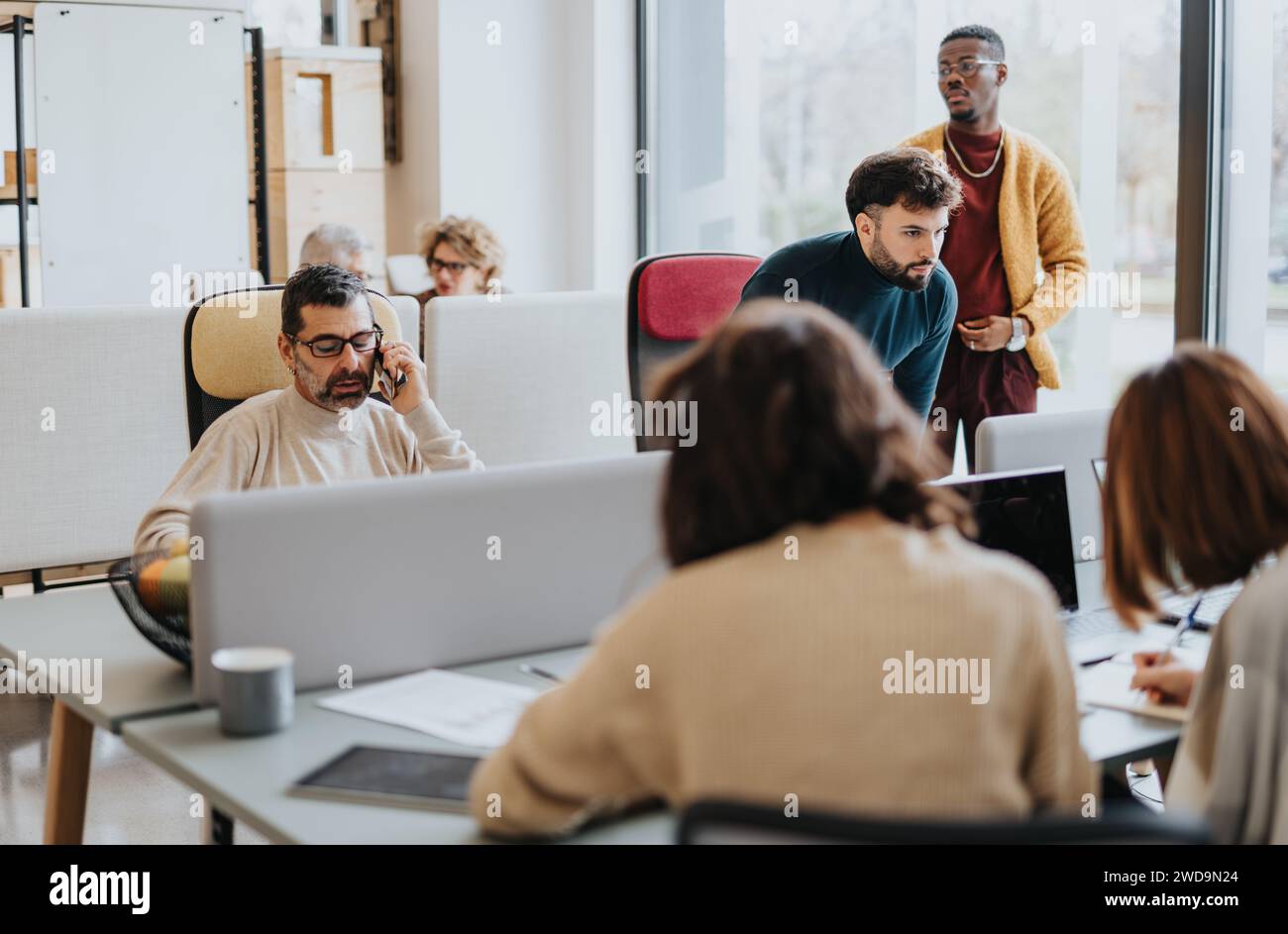 Business team working together in modern office. Multiracial and ...