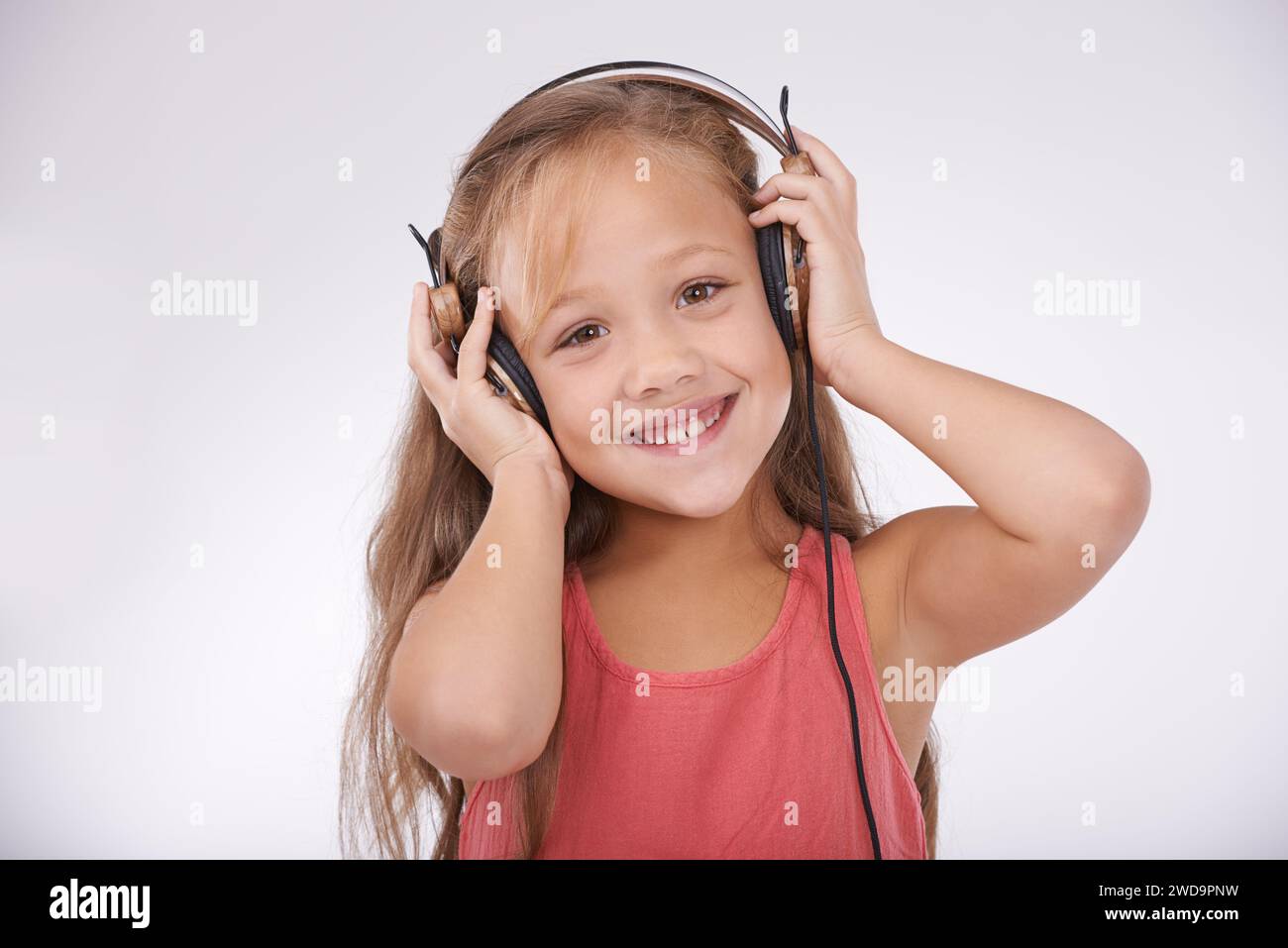 Kid, music and portrait of girl with headphones in studio for audio ...