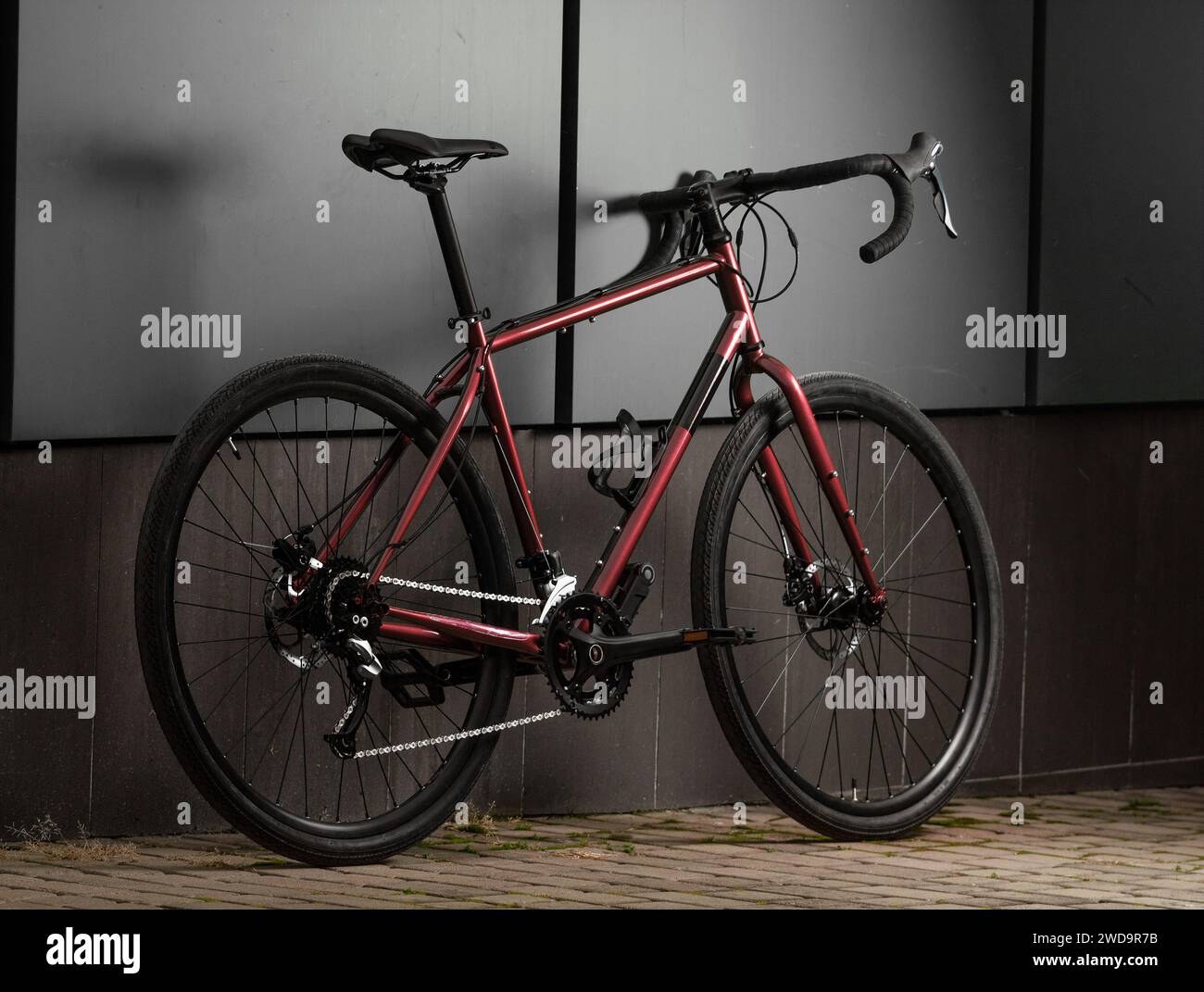 Bicycle for tourism. Red shiny road bike on grey background Stock Photo ...