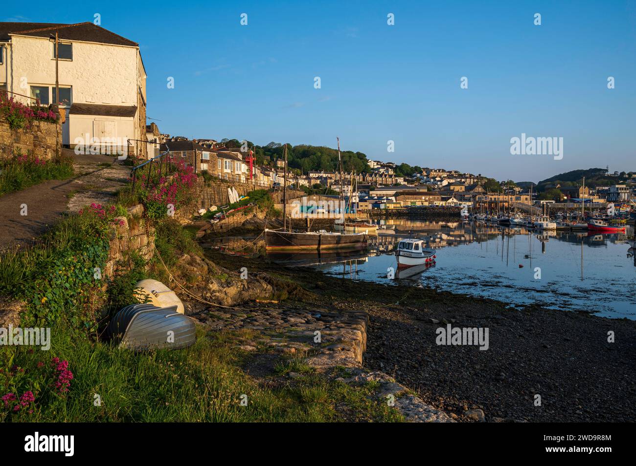 Newlyn Harbour, in Cornwall, early on a calm summers morning Stock ...