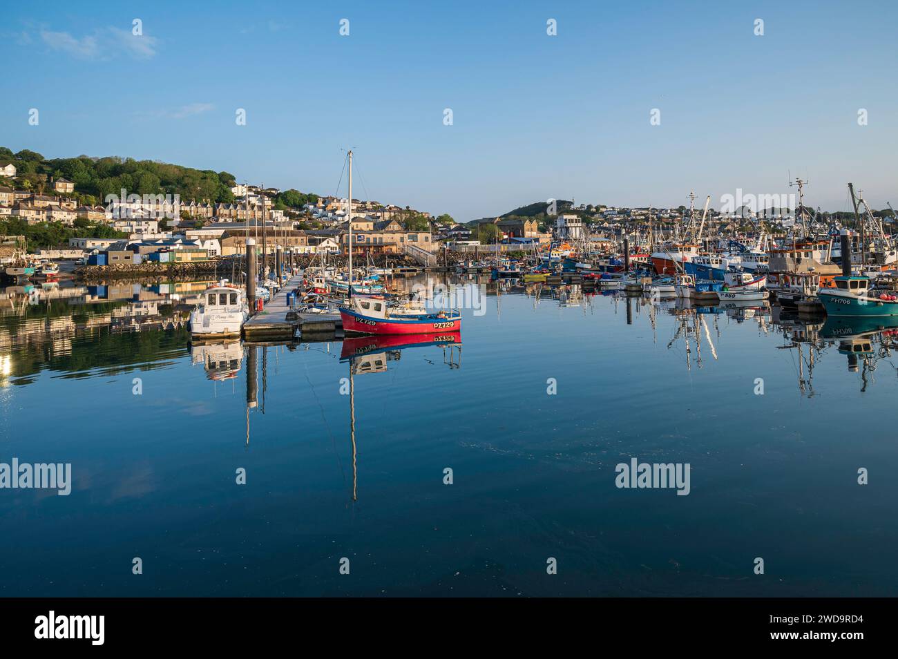 Newlyn Harbour, in Cornwall, early on a calm summers morning Stock ...