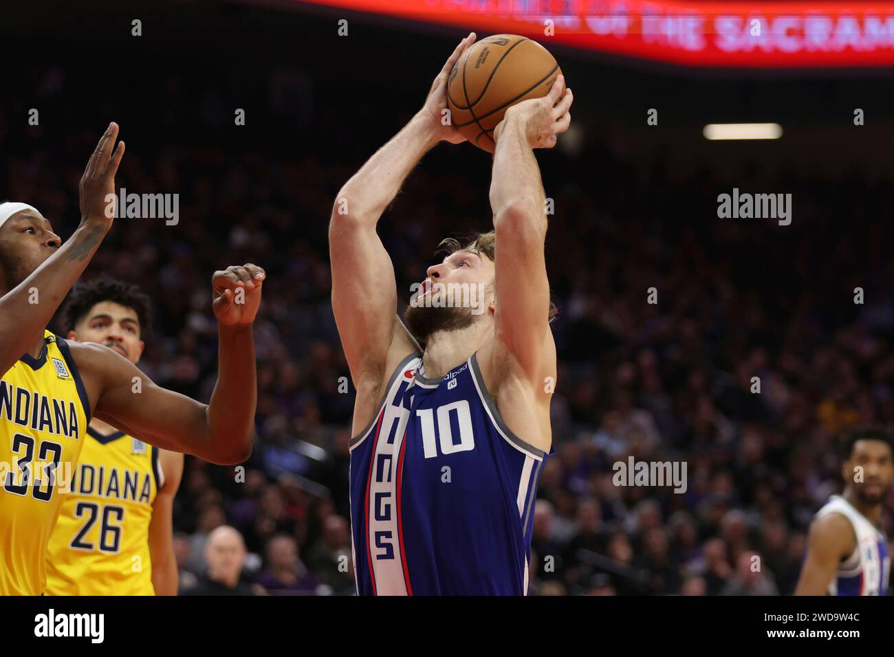 Sacramento Kings forward Domantas Sabonis (10) shoots against Indiana Pacers center Myles Turner ...