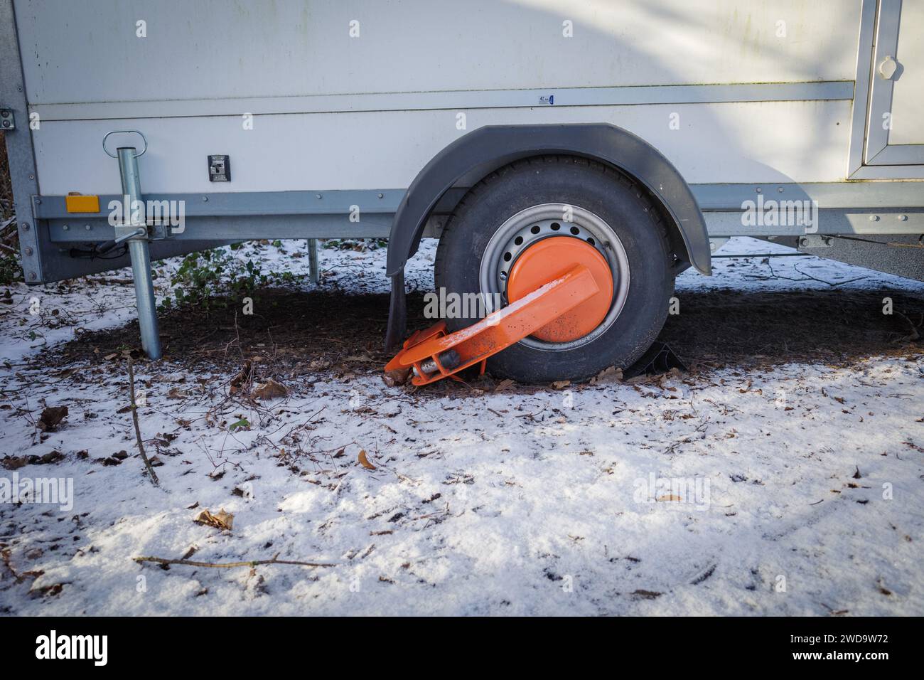 an immobilizer from the public order office is attached to one wheel of ...