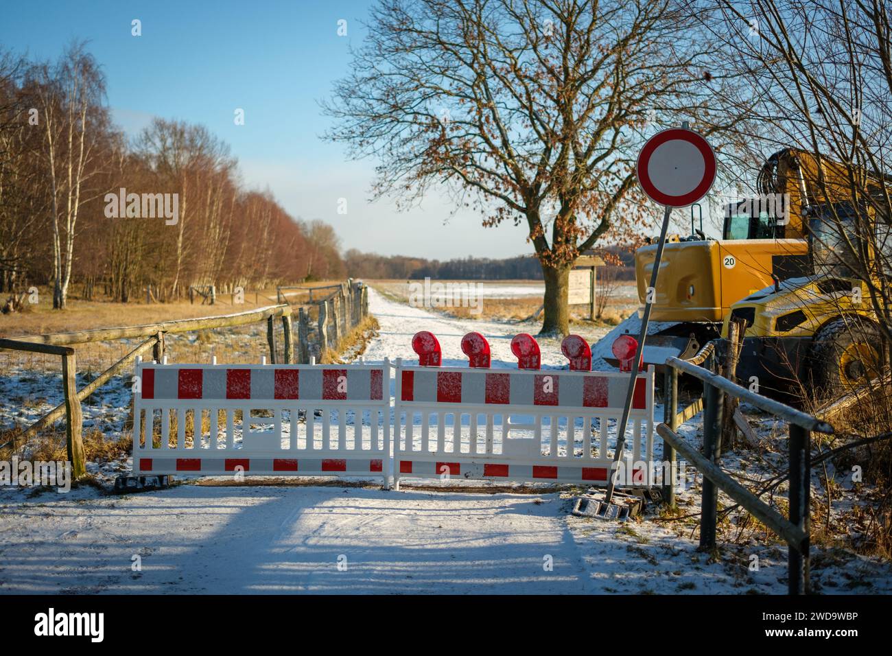 A path is blocked by a barrier and a traffic sign Stock Photo - Alamy