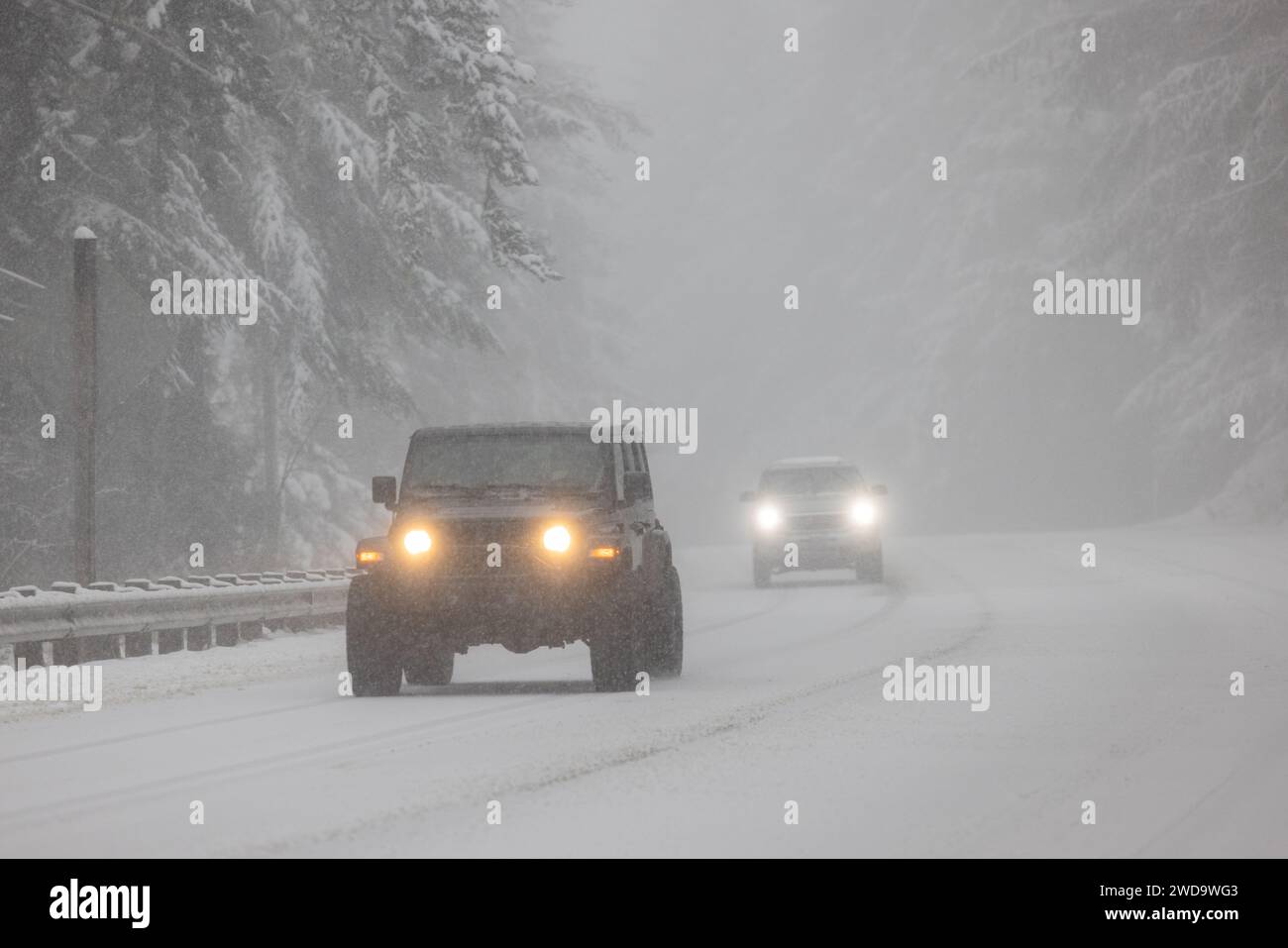 Passenger vehicles driving on snow covered highway 101 in Southern ...