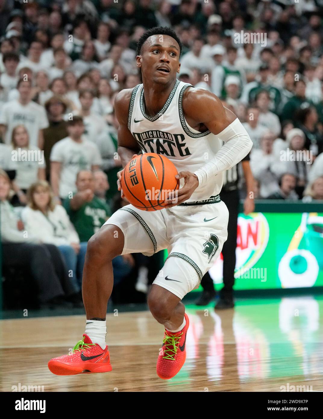 Michigan State guard Tyson Walker brings the ball up court during the ...