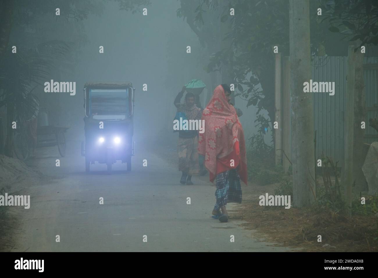 A densely foggy winter village morning. This image was captured on ...