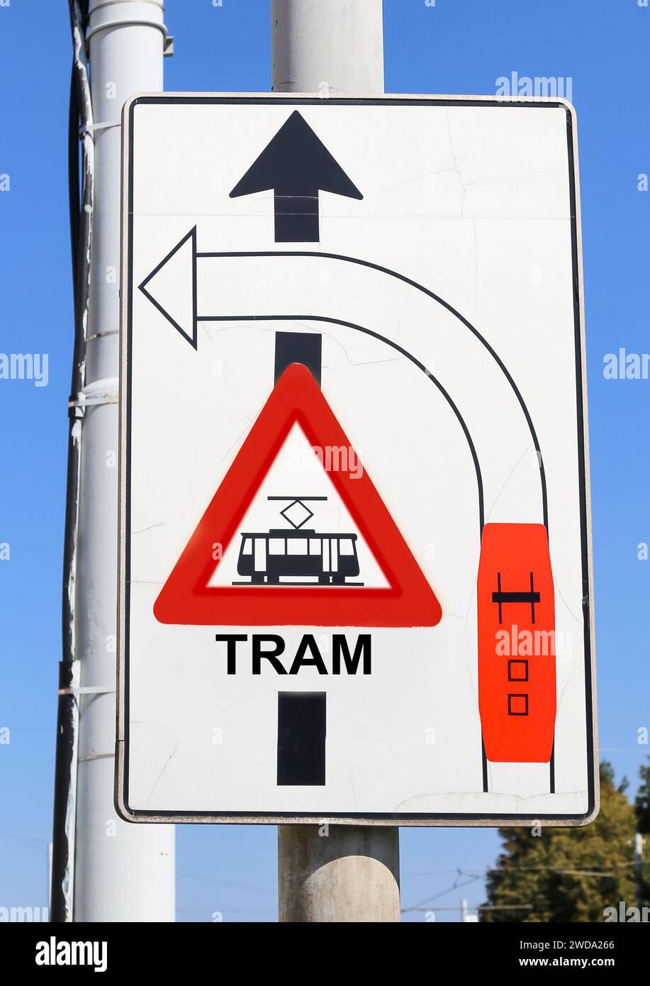 big road sign with attention signs of crossing tram tracks in the city ...