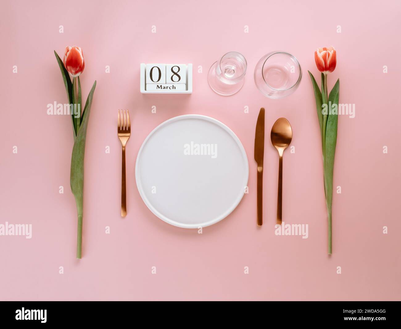 8 march table setting. Empty white plate, calendar with march eight ...