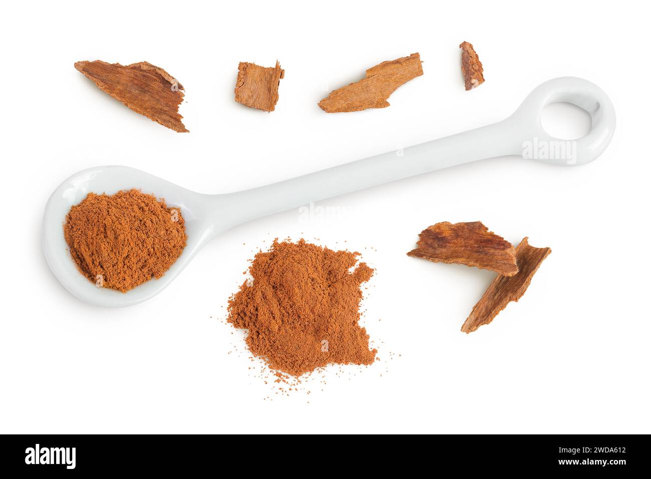 Cinnamon powder in ceramic spoon with cinnamon stick crushed isolated ...