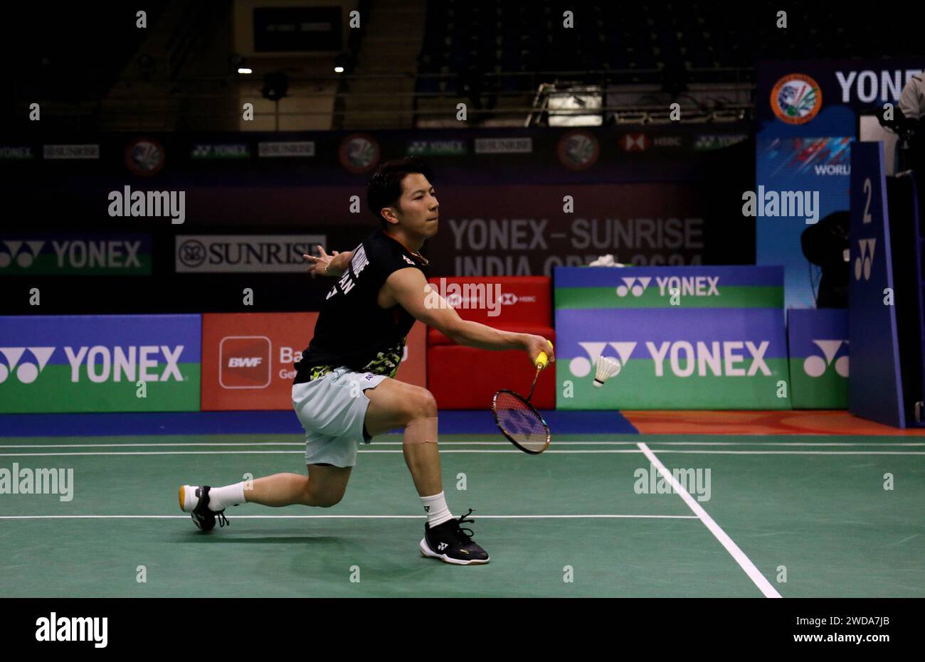 New Delhi, India. 19th Jan, 2024. Japan's Koki Watanabe plays against China's Chi Yu Qi (not ...